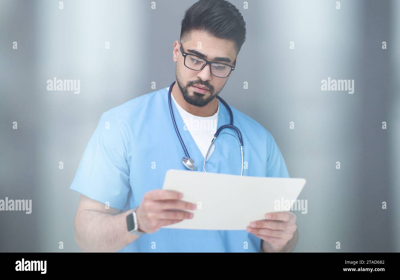 doctor doing paperwork checking medical documents at workplace Stock ...