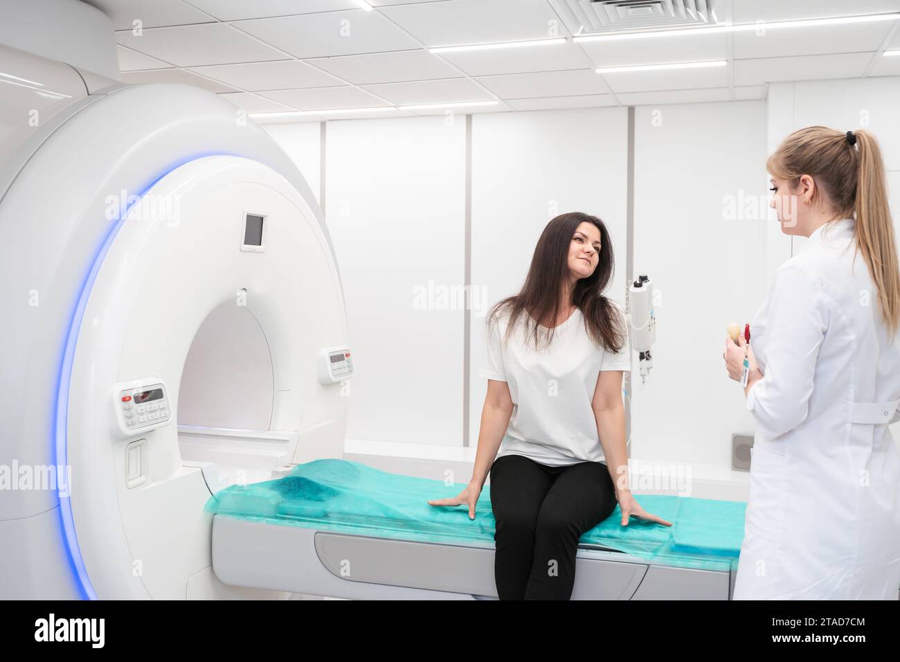Female patient undergoing MRI - Magnetic resonance imaging in Hospital ...