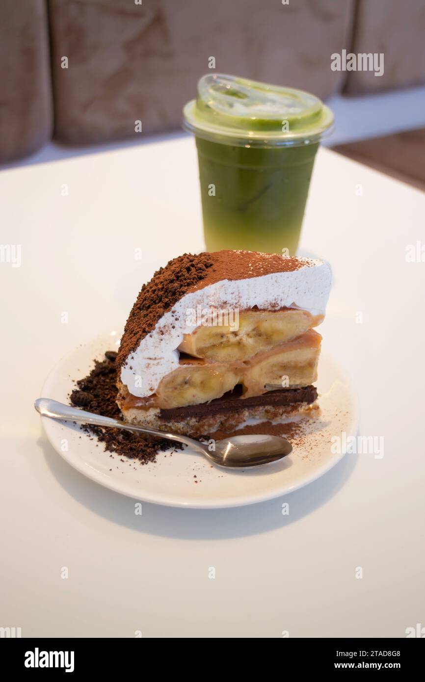 Banoffee cake with bananas and whipped cream in cafe restaurant, stock ...