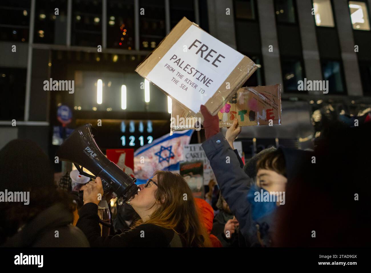 NEW YORK, NEW YORK - NOVEMBER 29: Pro-Palistine protesters holds up ...