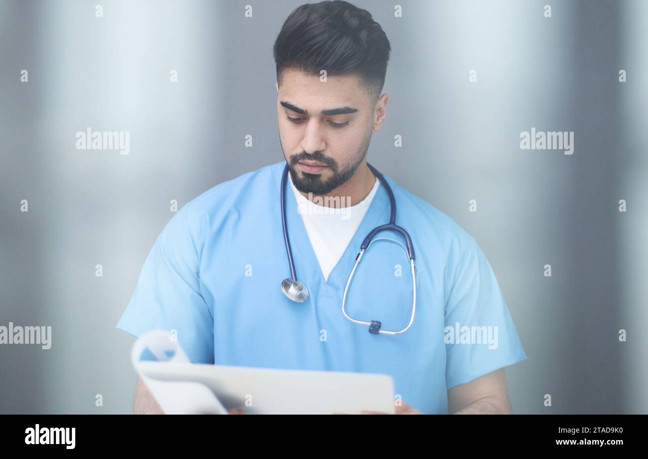 reading medic form analyzing patient diagnosis or report in hospital ...