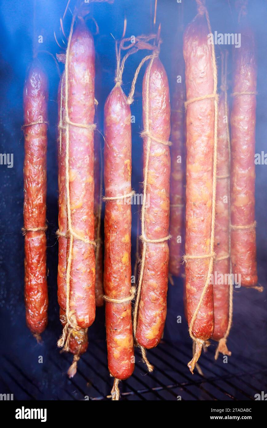 In traditional smoking house, smoked sausages are hung on racks Stock ...