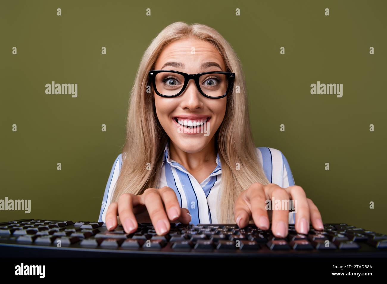 Photo portrait of blonde lovely young lady typing keyboard excited ...
