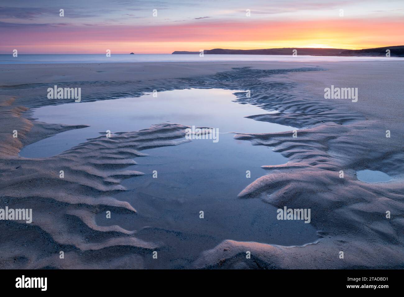 Colourful dawn sky over Harlyn Beach in North Cornwall, England. Spring ...
