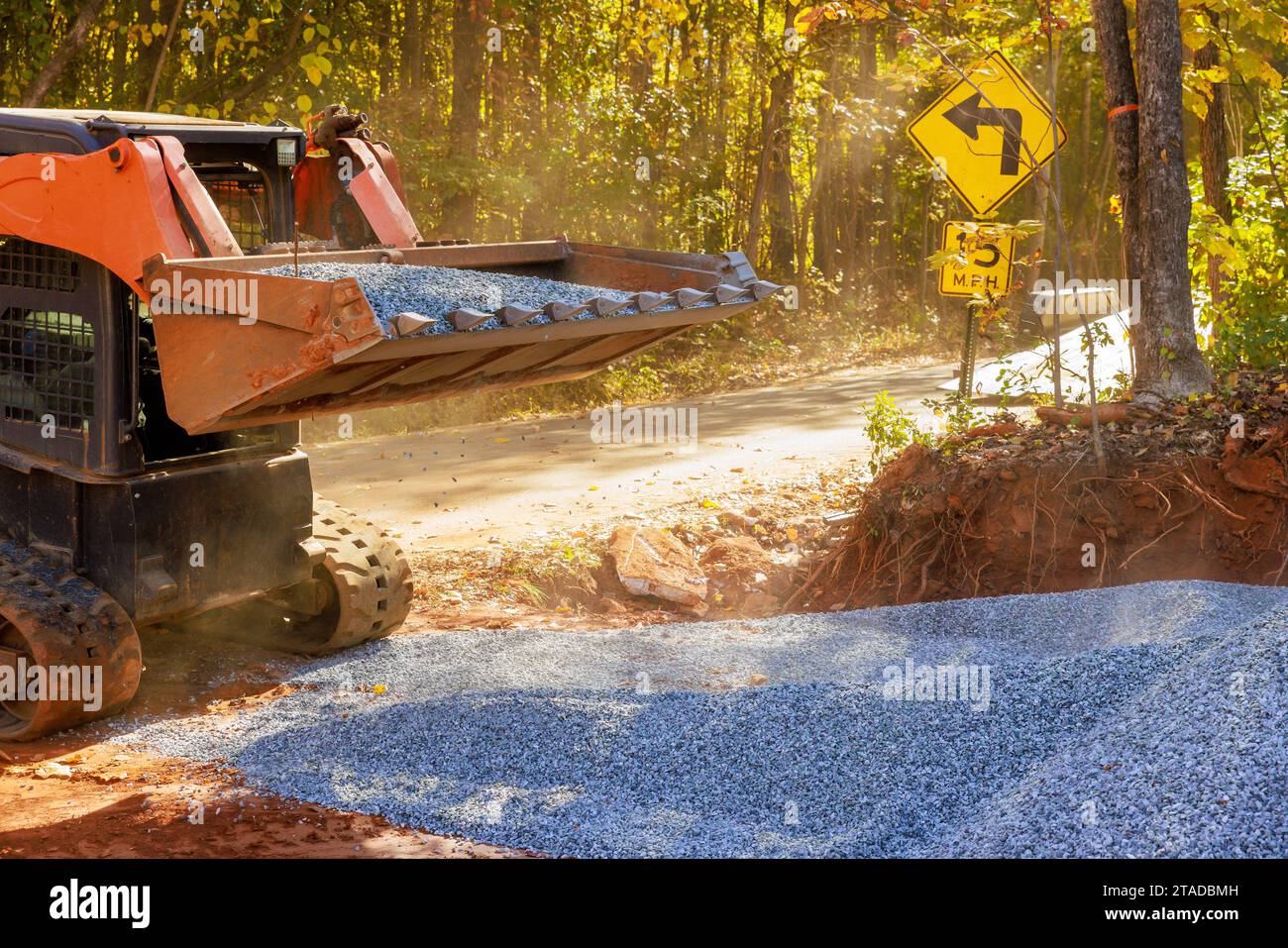 Preparation laying of crushed stone gravel for new road by using ...