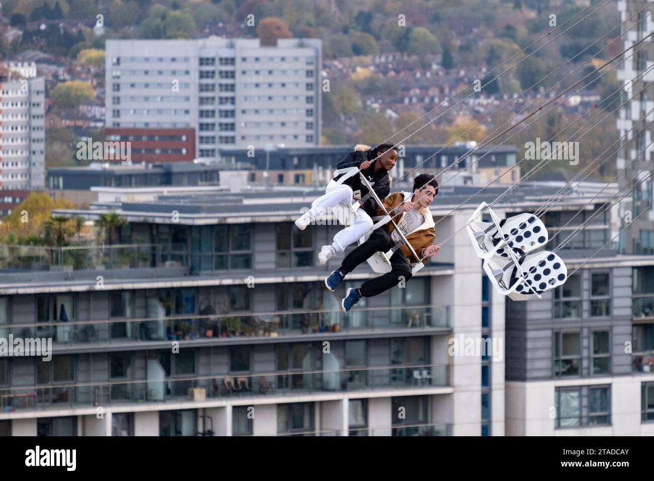 Thrill seekers enjoy flying high above the city centre on the City Star ...