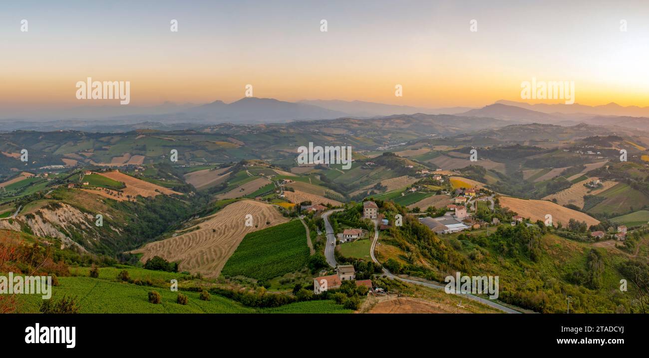 Rural landscape in Umbria, Italy with houses and vineyard at sunset ...