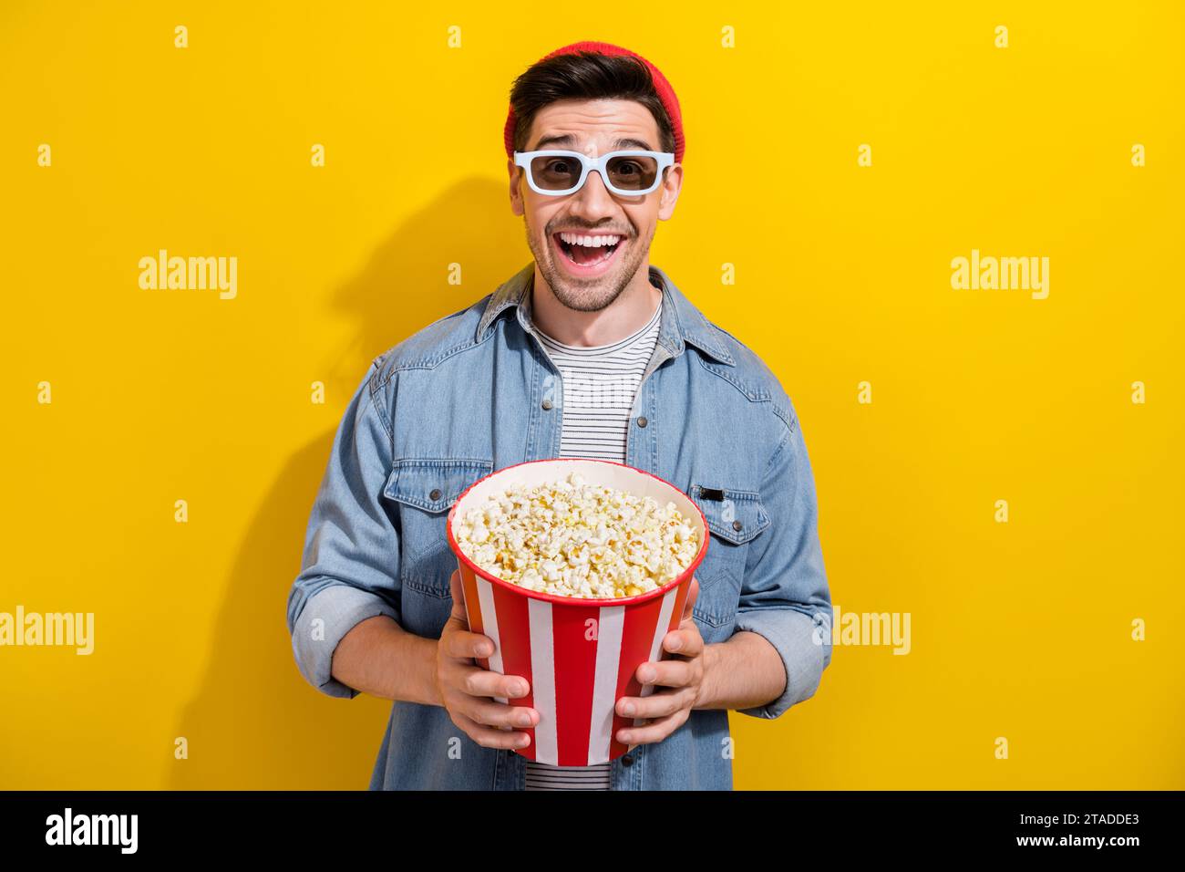 Photo of impressed positive guy wear denim jacket watching vr movie ...