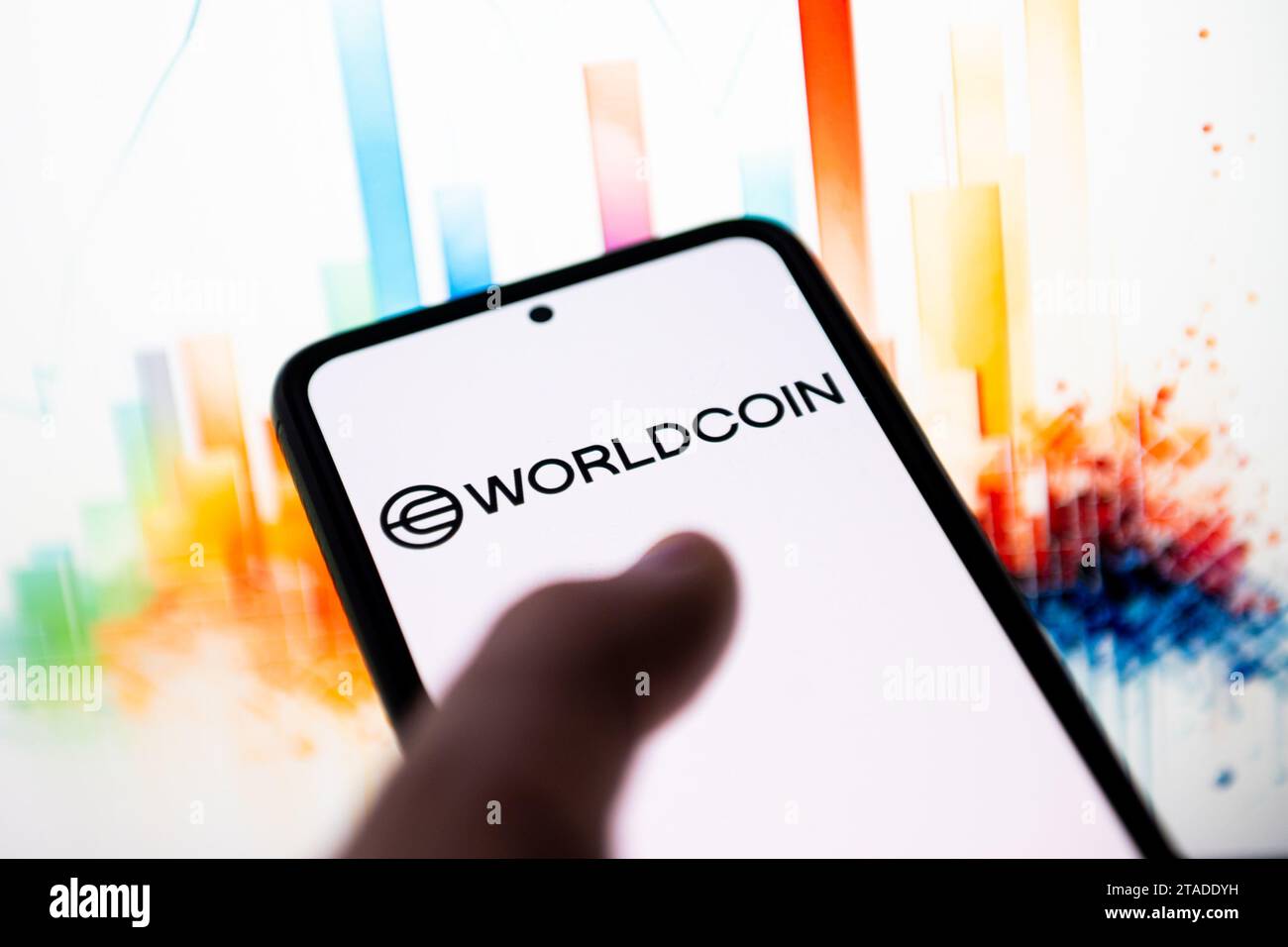 In this photo illustration a Worldcoin logo seen displayed on a smartphone Stock Photo - Alamy