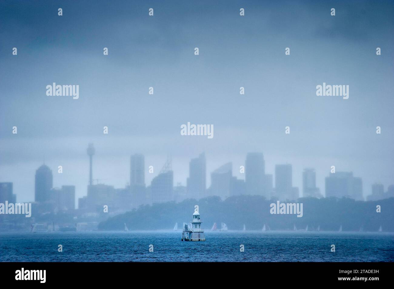 Skyline with lighthouse from Watson bay in the rain, Sydney, Australia ...