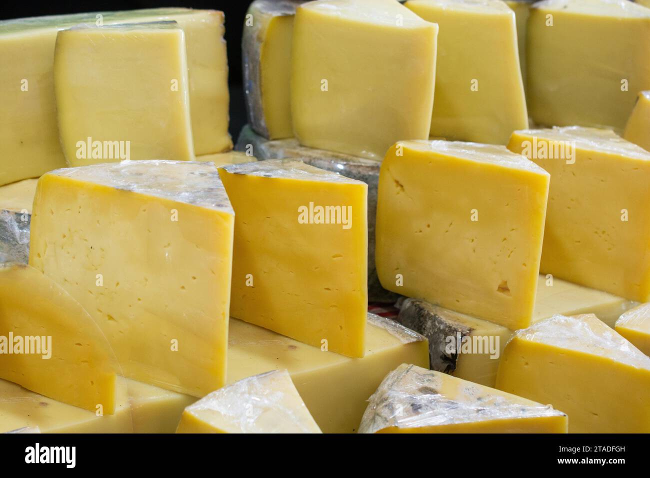 Cuts of kashkaval or kasseri cheese for sale on the shelf Stock Photo ...