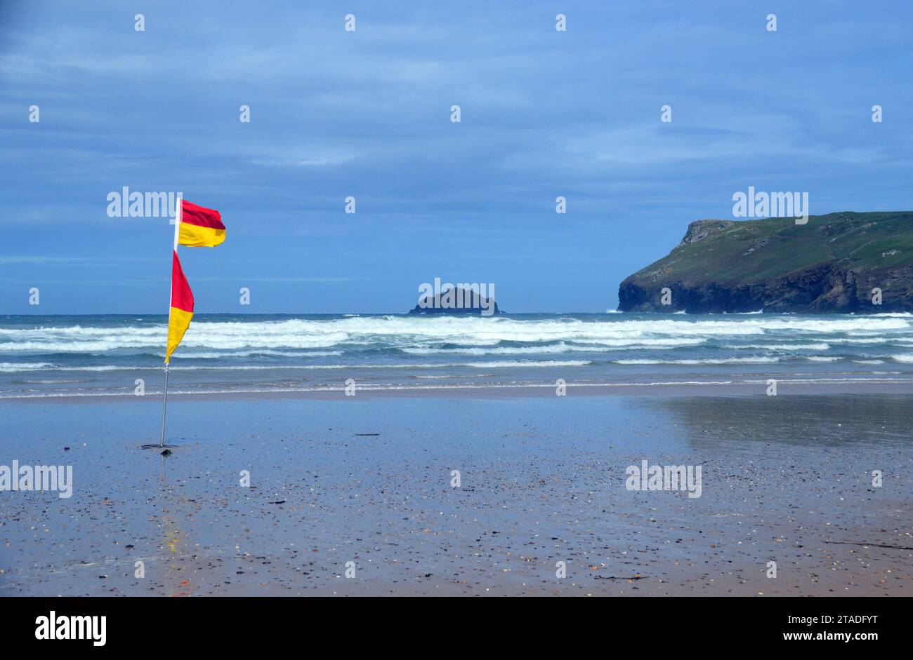 Newland Island and Pentire Point from a Red and Yellow RNLI Beach Flag ...