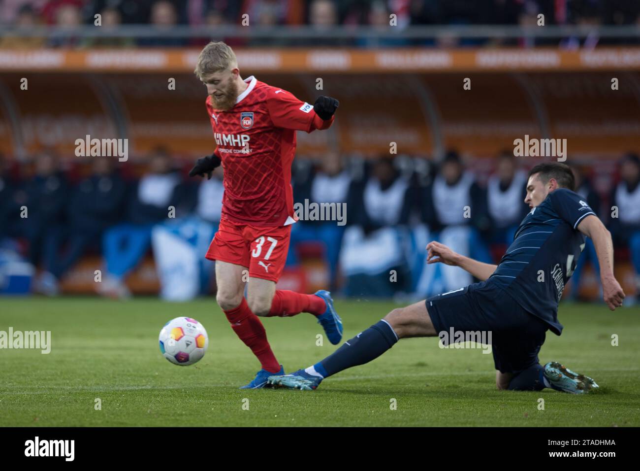 Jan-Niklas BESTE 1. FC Heidenheim left in a duel with Keven ...