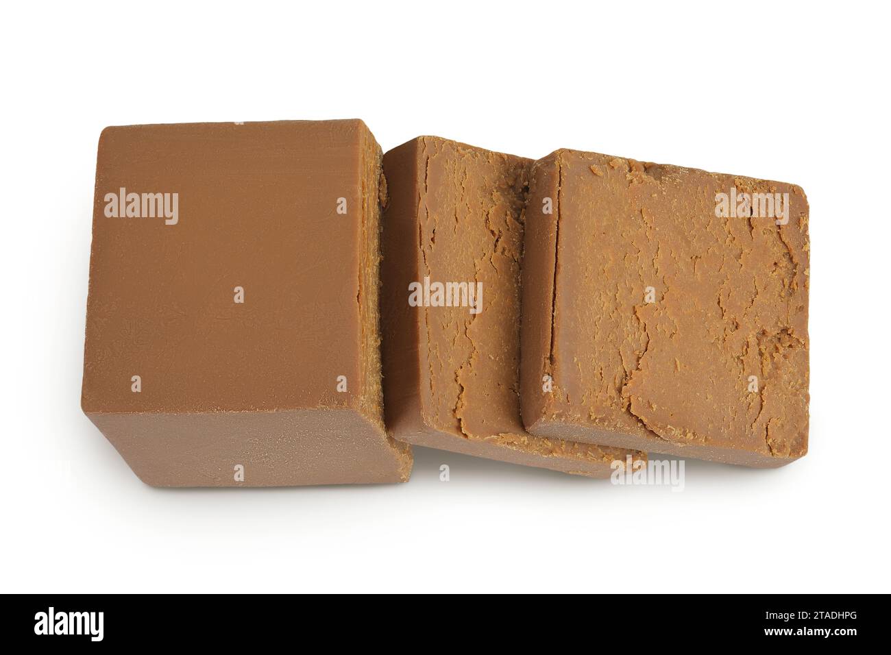 Brown cheese. Norwegian brunost isolated on white background. Top view ...