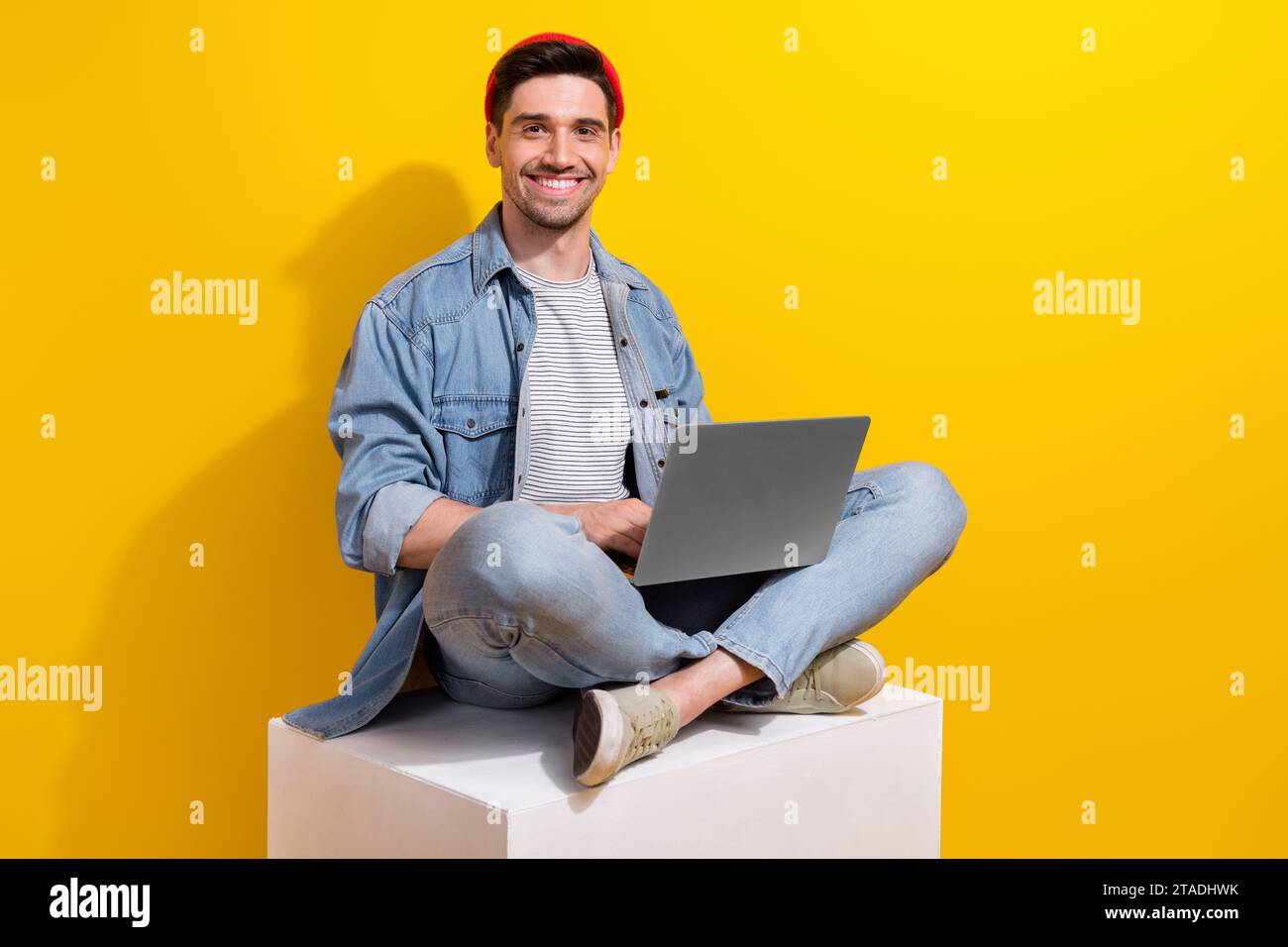 Photo of smart clever guy wear denim jacket communicating modern device ...