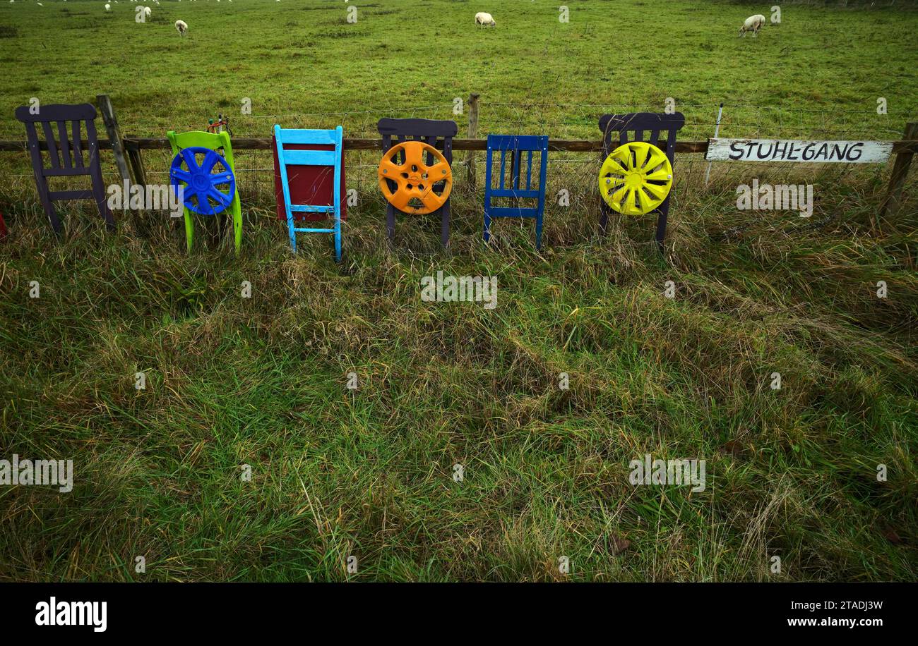 Art installation of a gallery, stool, humour, various folding chairs ...