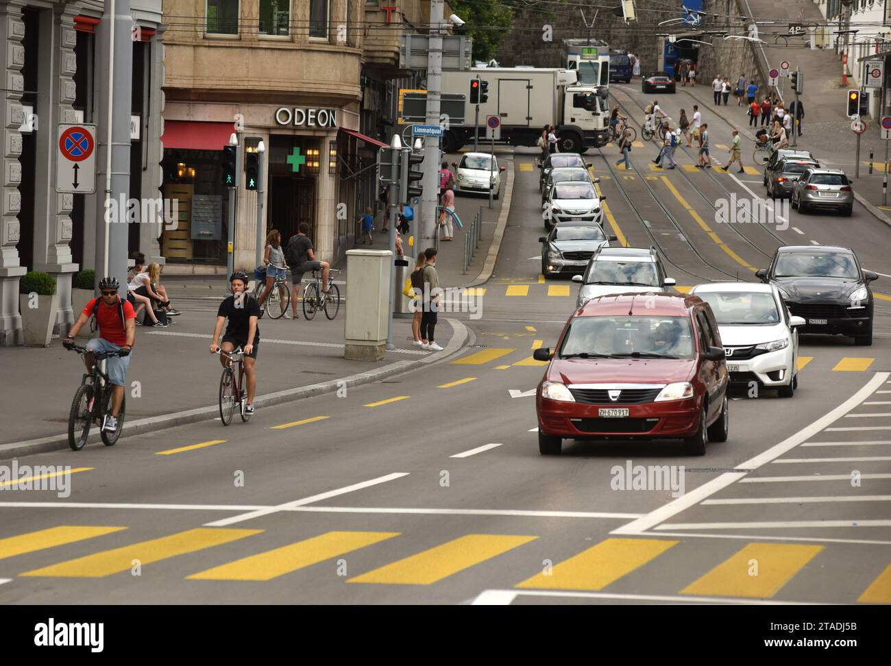 Zurich, Switzerland - June 03, 2017: Bicyclists and cars on street of ... Zurich, Switzerland - June 03, 2017: Bicyclists and cars on street of ...