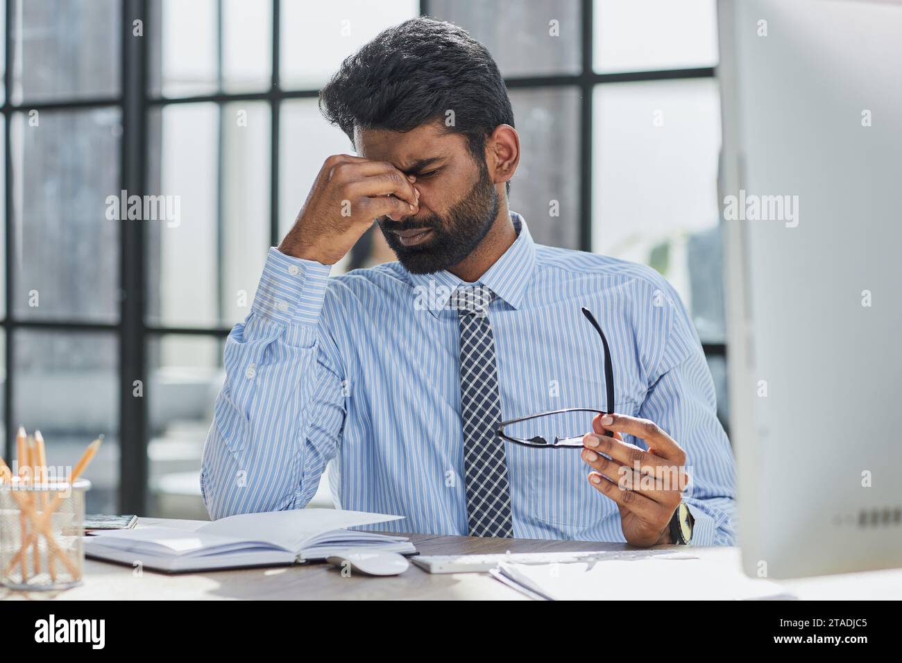 Tired stressed business man take off glasses fatigued of computer ...