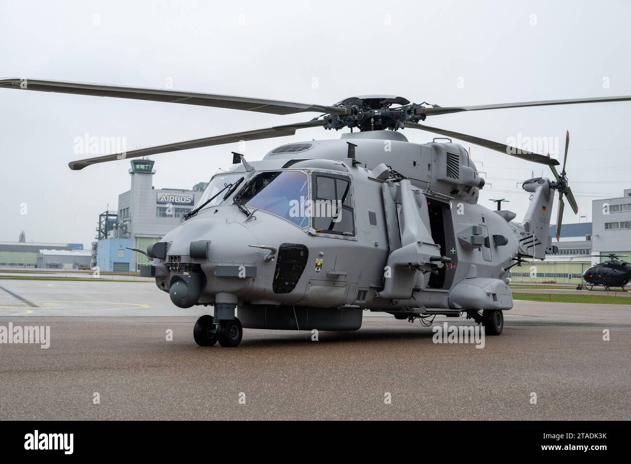 30 November 2023, Bavaria, Donauwörth: An NH90 Sea Tiger combat helicopter stands on the Airbus ...