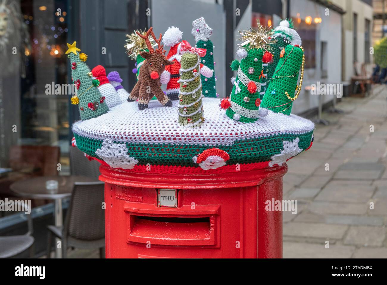 A knitted festive decorative cover on a red letter box in Folkestone ...