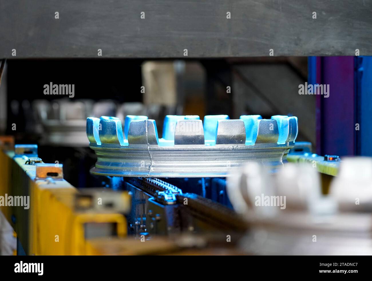 Chongqing, China. 28th Nov, 2023. A primary wheel hub product undergoes ...