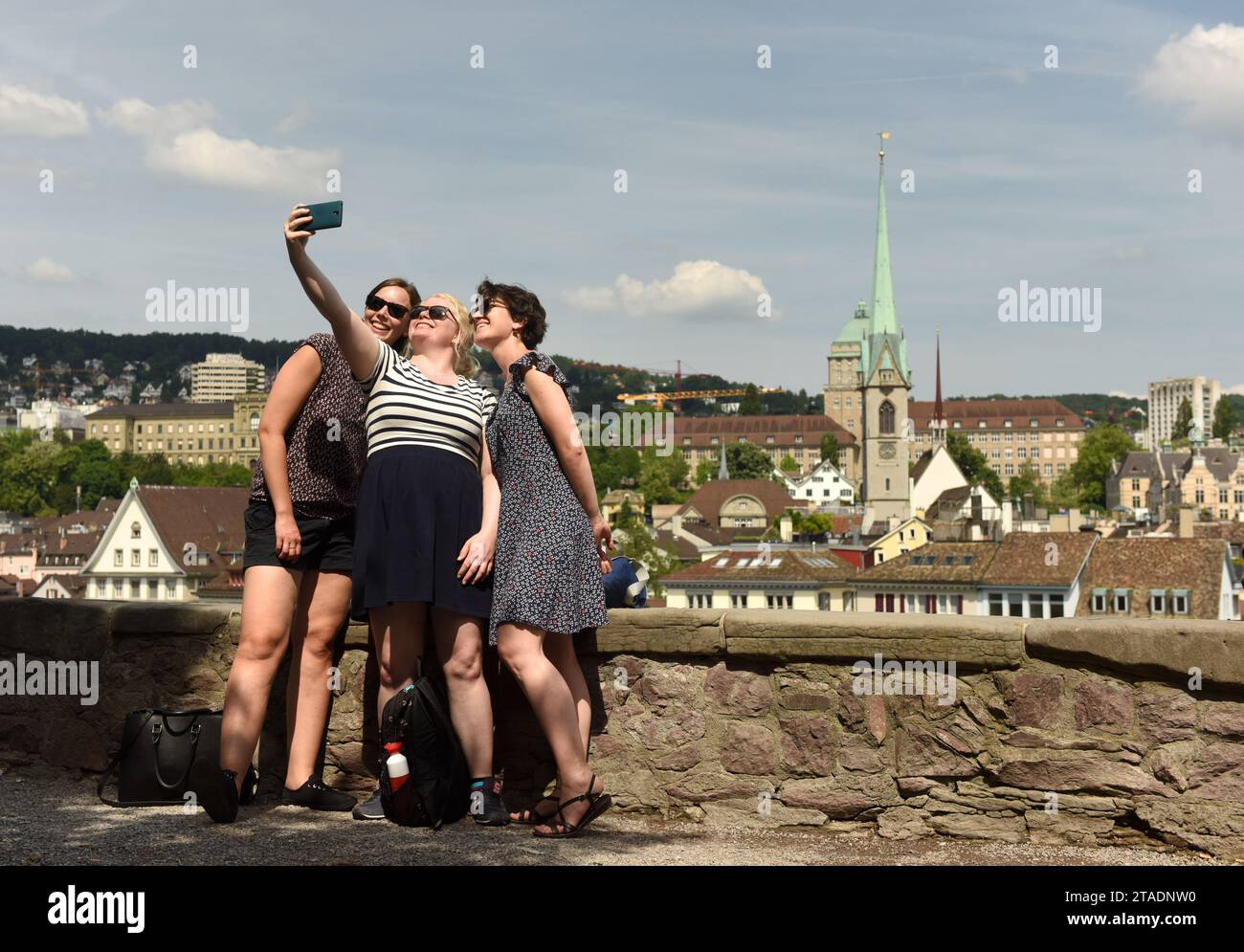 Zurich, Switzerland - June 03, 2017: Young women makes selfie with ... Zurich, Switzerland - June 03, 2017: Young women makes selfie with ...