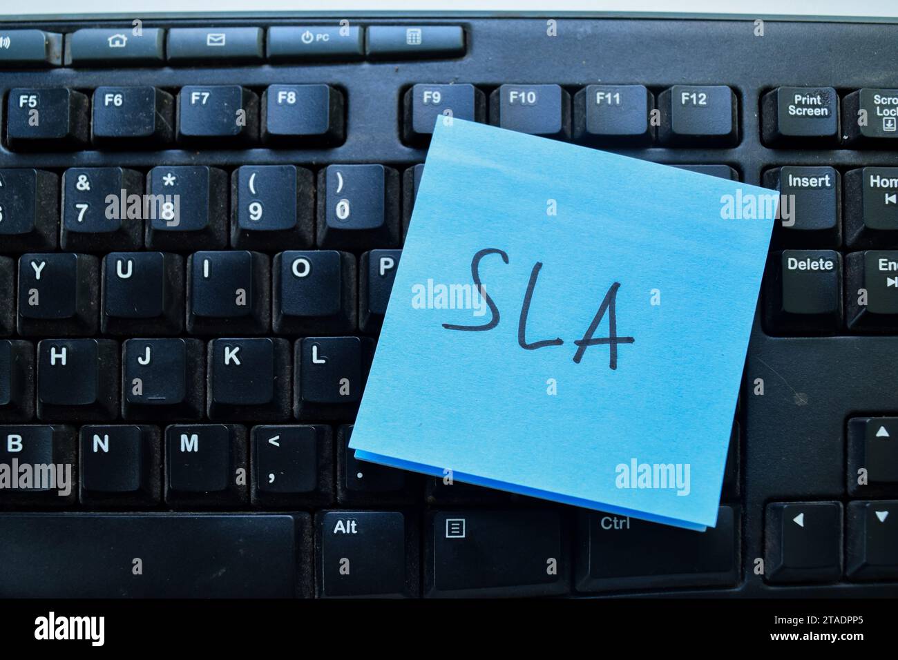 Concept of SLA write on sticky notes isolated on keyboard Stock Photo ...