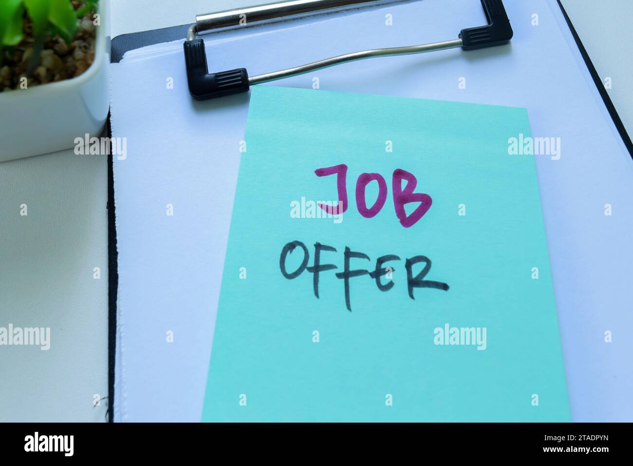 Concept of Job Offer write on sticky notes isolated on white background ...