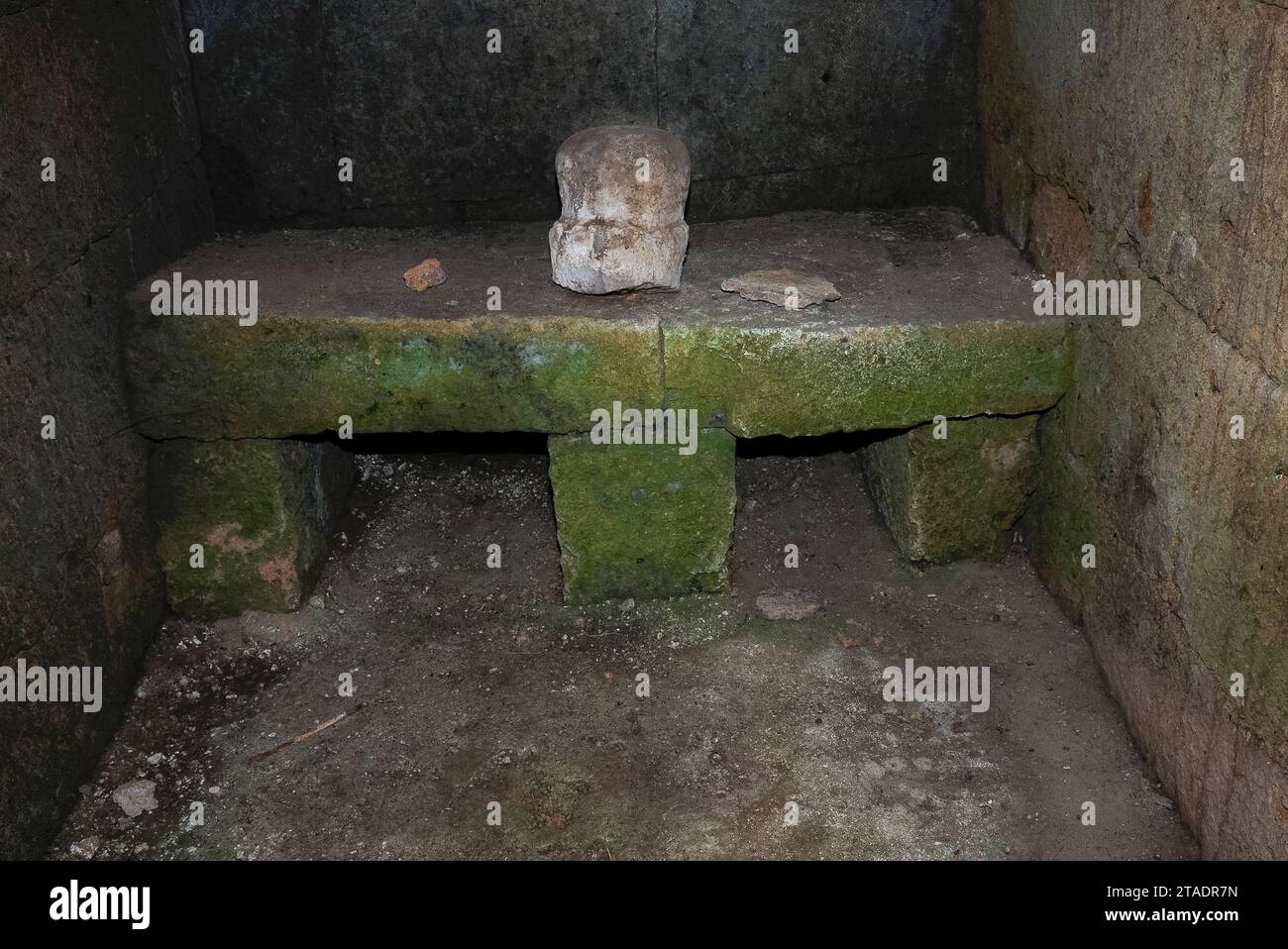 Stone bench inside a tomb in the Etruscan necropolis of Crocifisso del ...