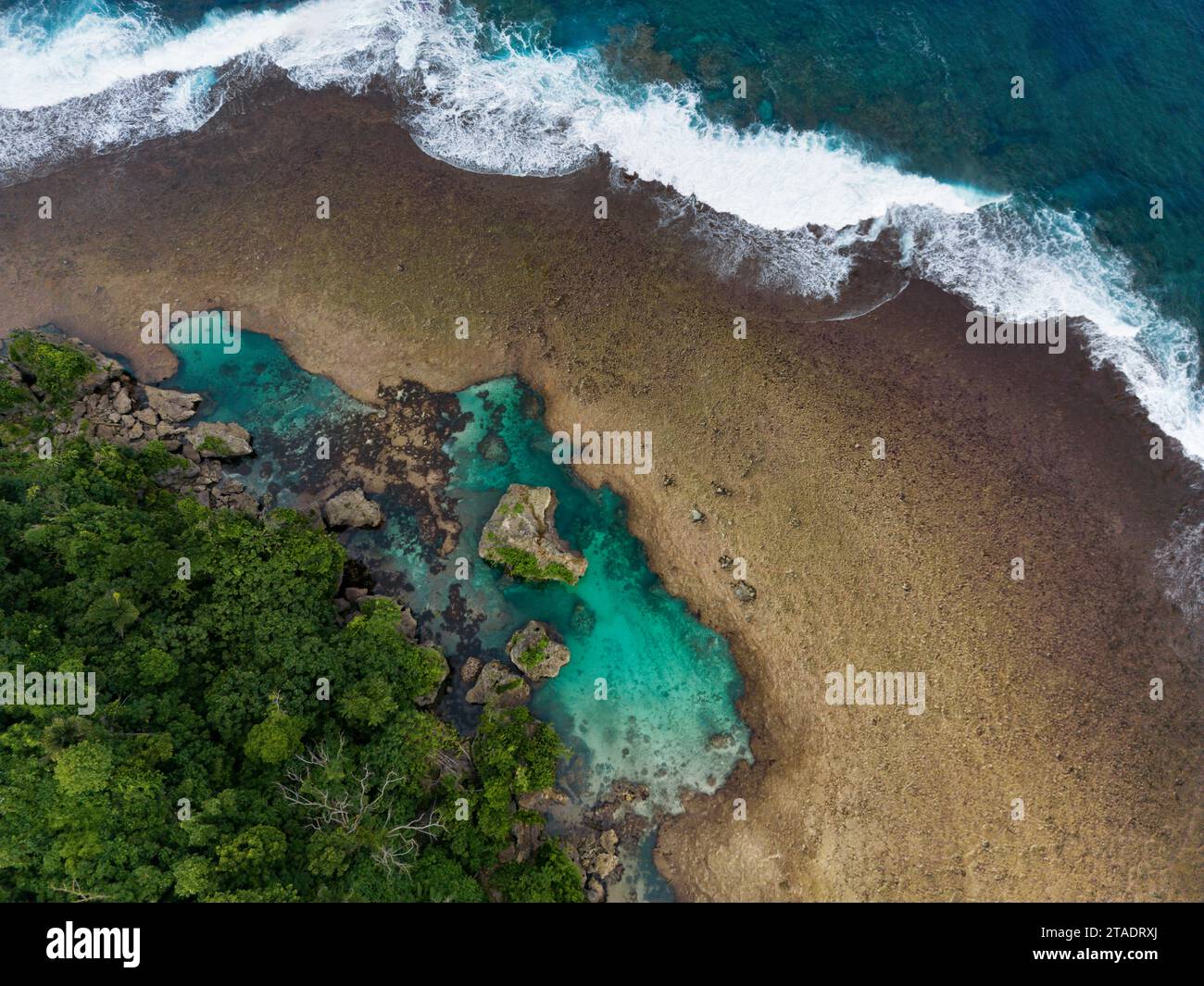 A scenic aerial view of Magpupungko Tidal Pool, Siargao, Philippines ...
