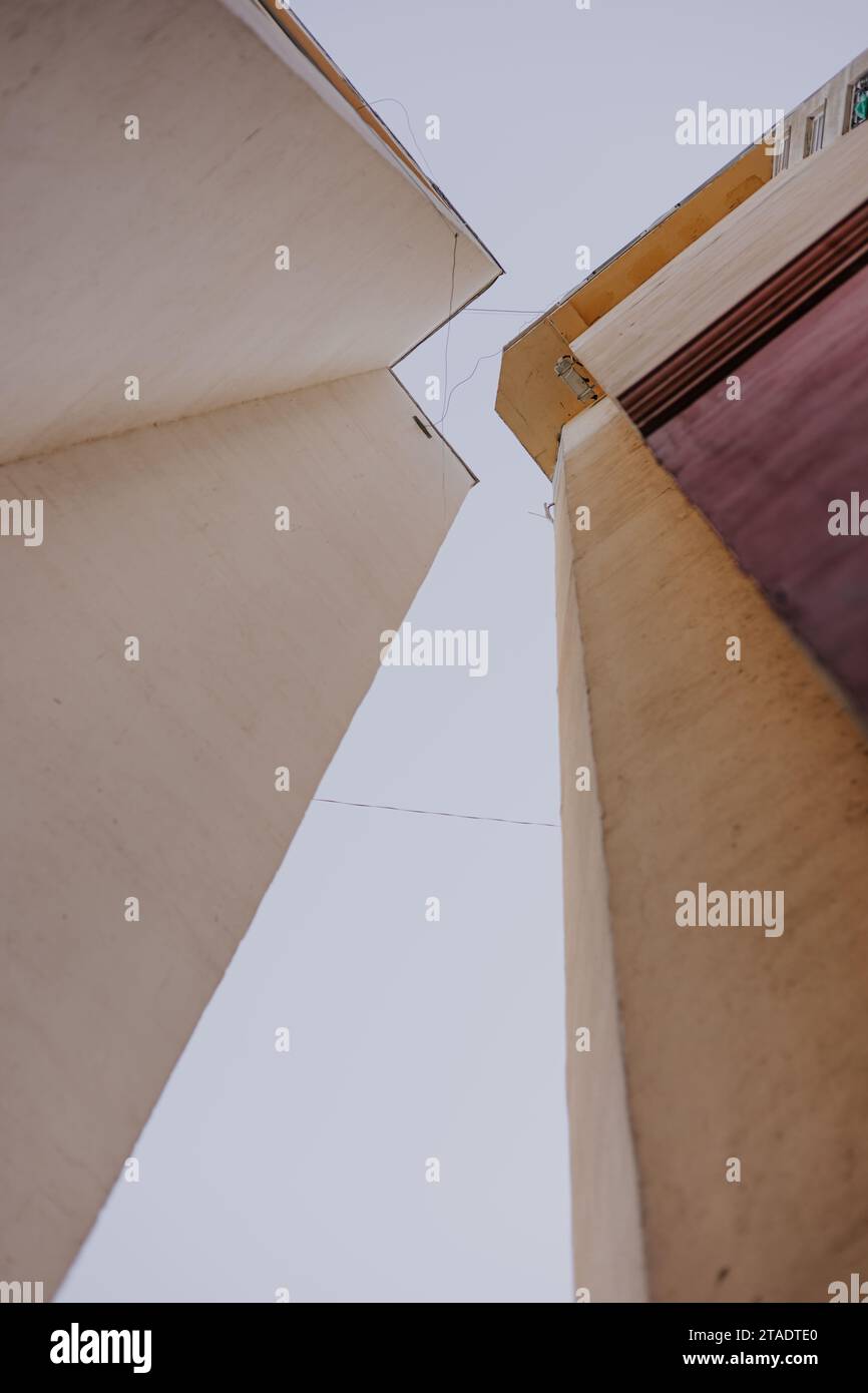 Passage between houses. Corners of two buildings built very close to ...