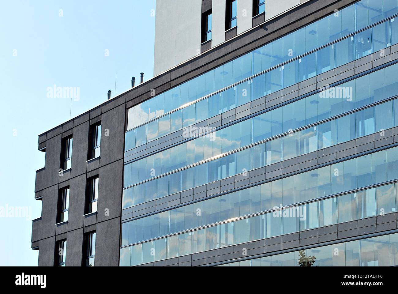 New apartment building with glass balconies. Modern architecture houses ...