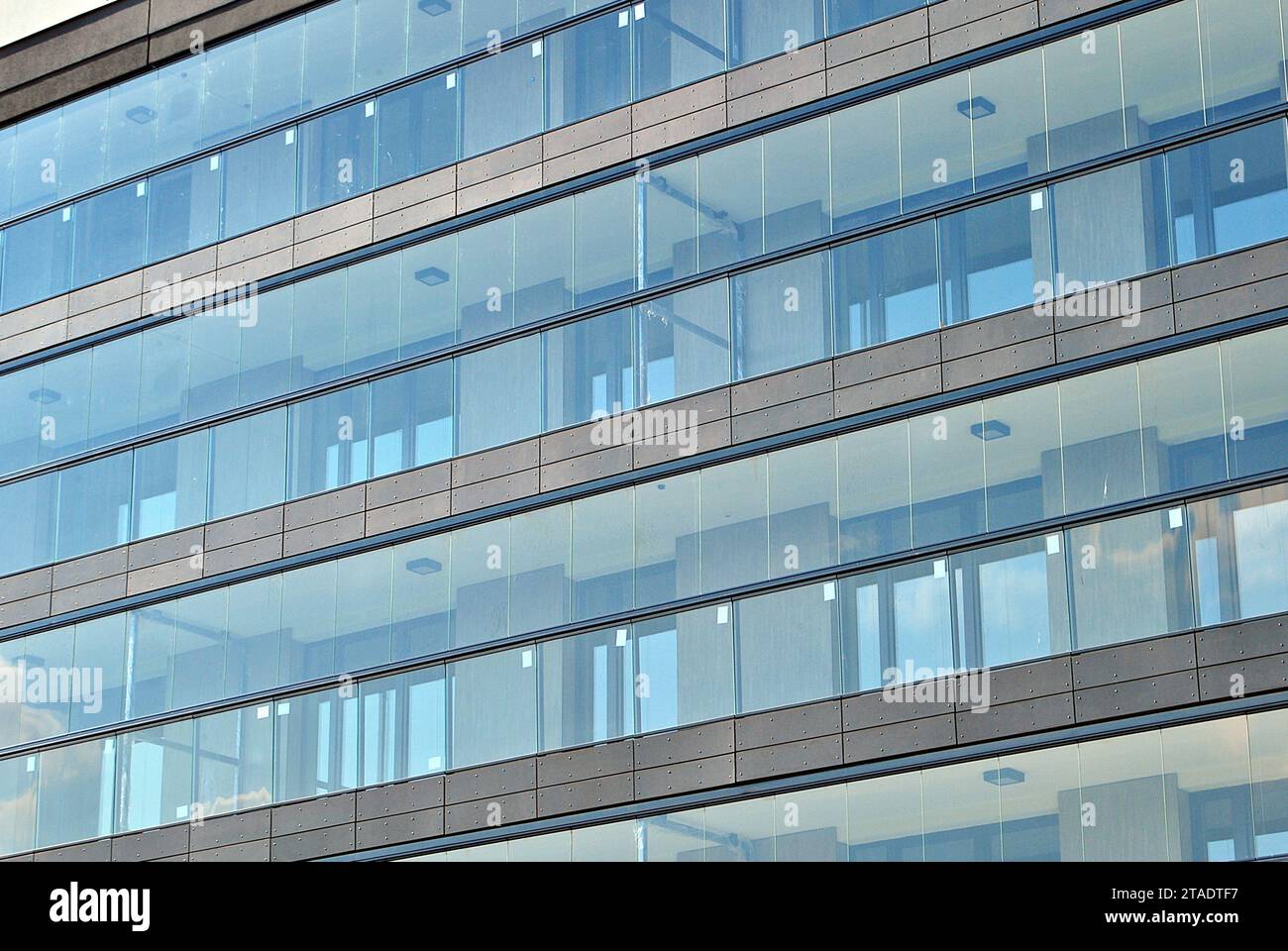 New apartment building with glass balconies. Modern architecture houses ...