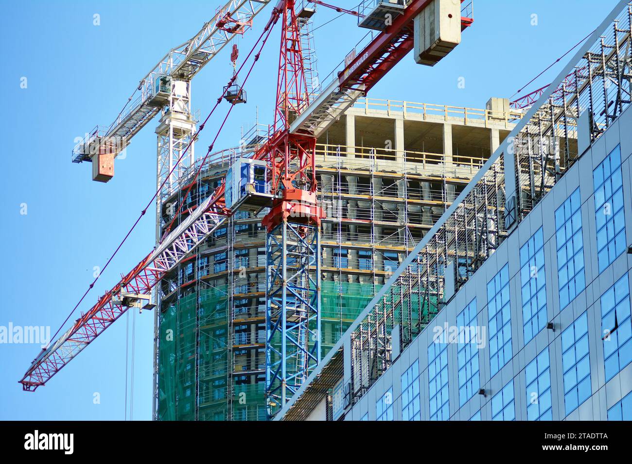 High rise building under construction. Installation of glass facade ...