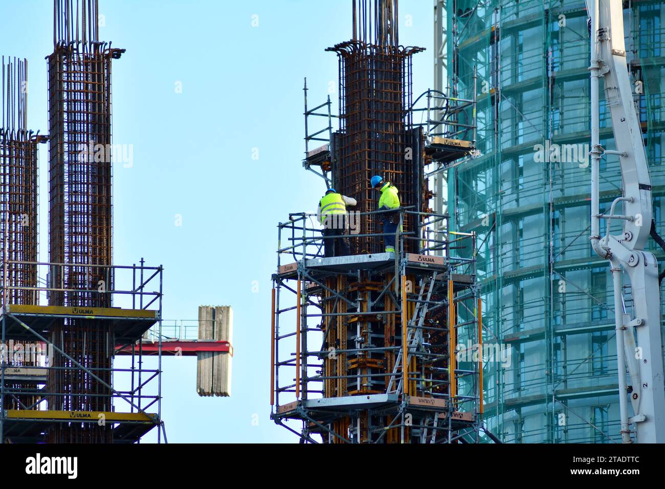 High rise building under construction. Installation of glass facade ...