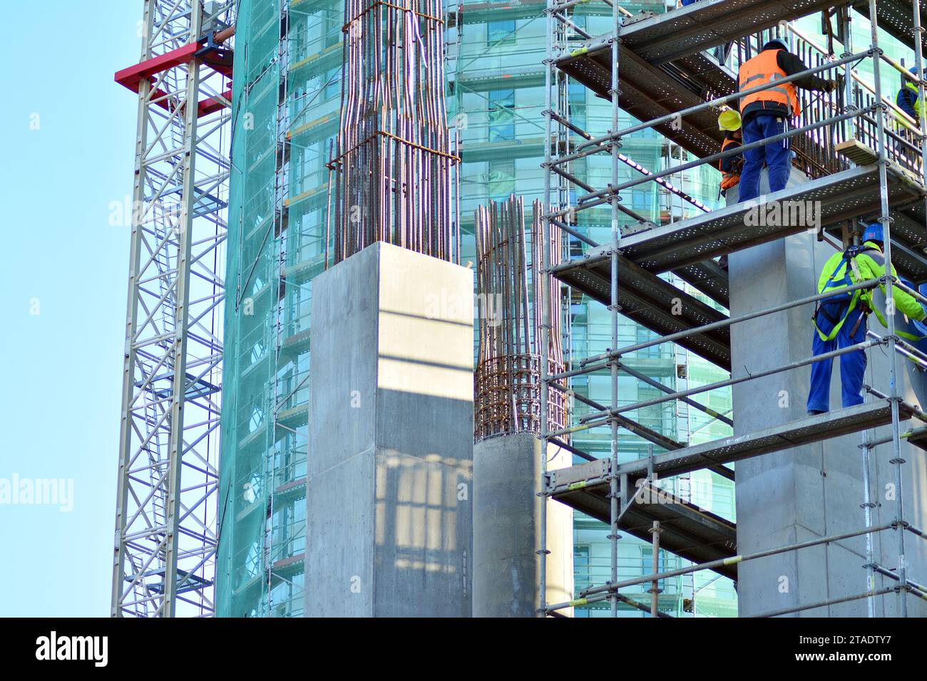 High rise building under construction. Installation of glass facade ...