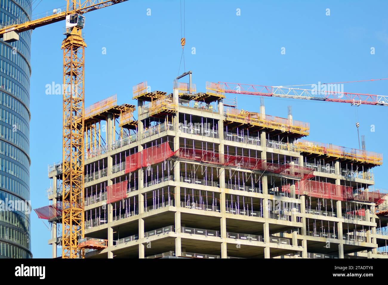 High rise building under construction. Installation of glass facade ...