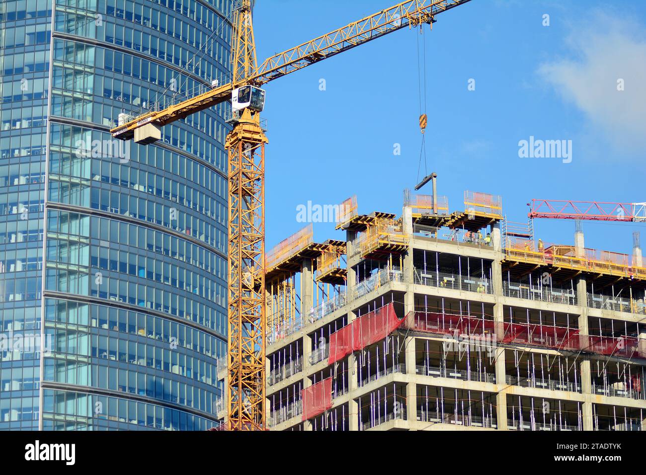 High rise building under construction. Installation of glass facade ...
