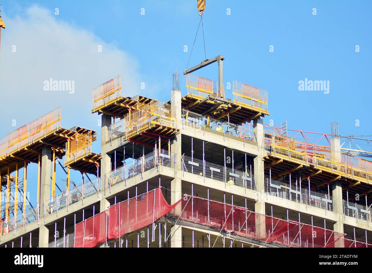 High rise building under construction. Installation of glass facade ...