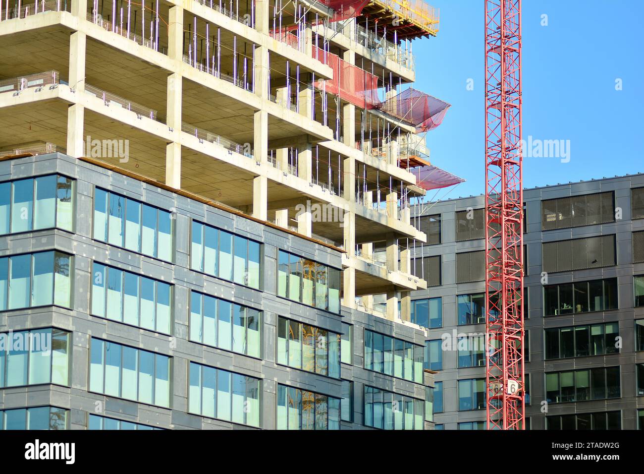 High rise building under construction. Installation of glass facade ...