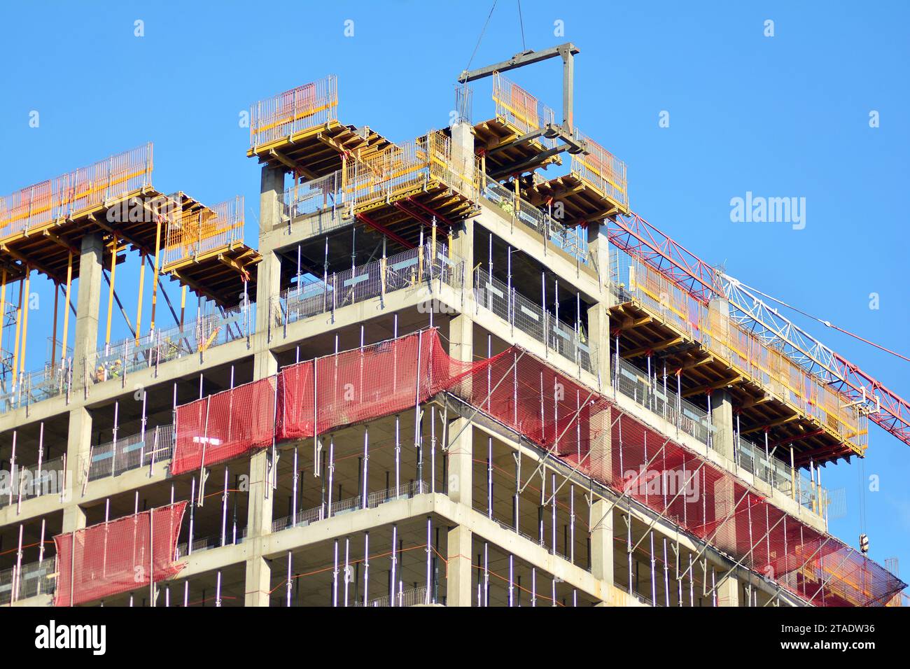 High rise building under construction. Installation of glass facade ...