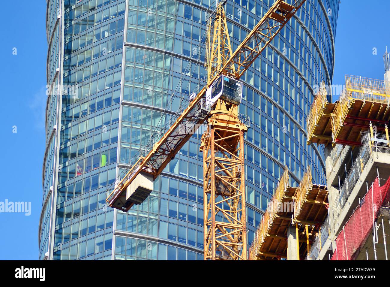 High rise building under construction. Installation of glass facade ...