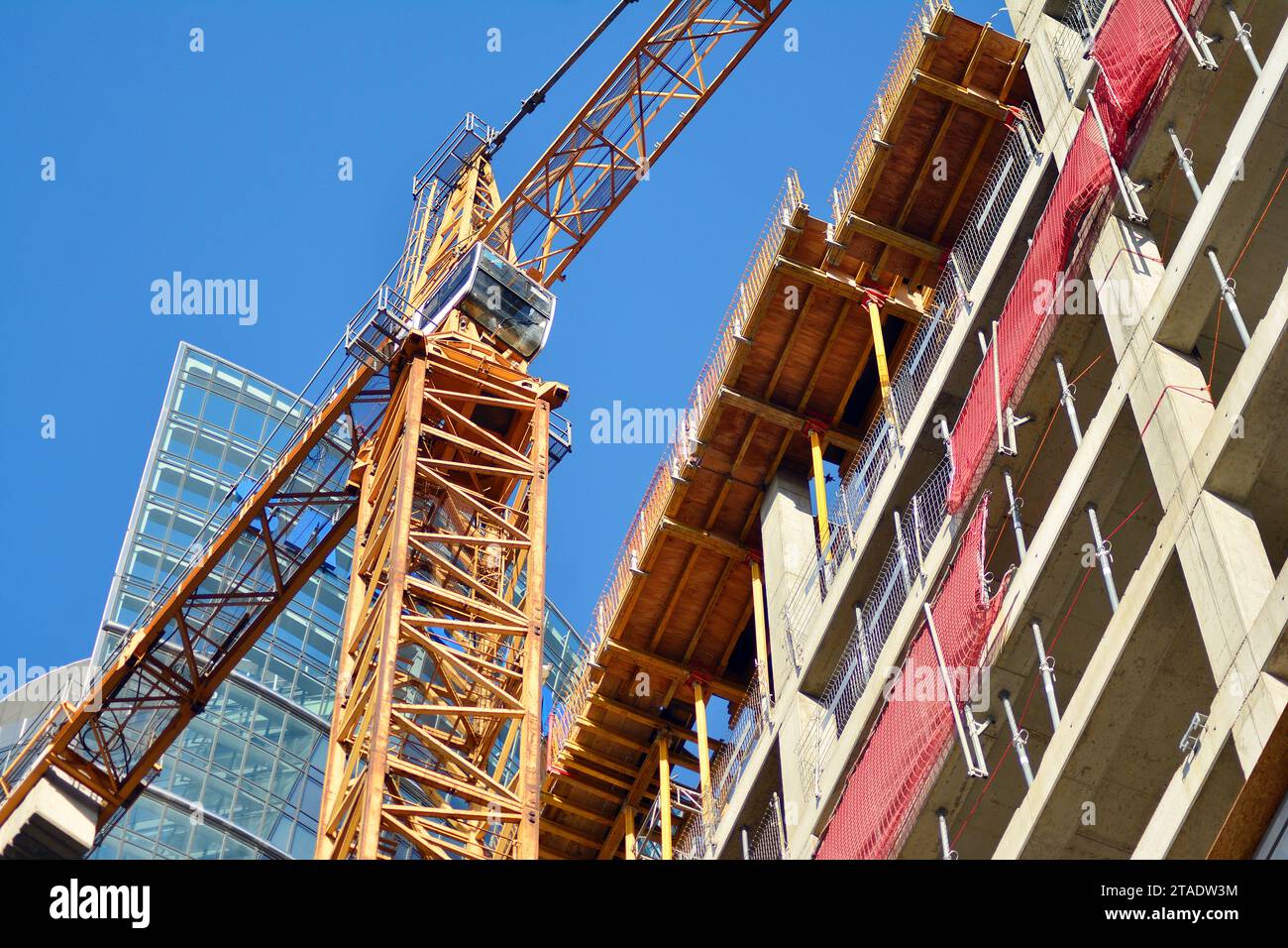 High rise building under construction. Installation of glass facade ...