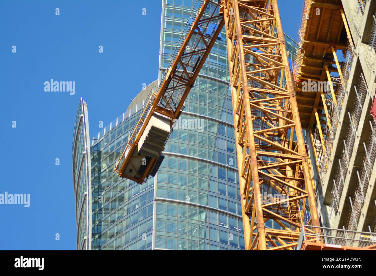 High rise building under construction. Installation of glass facade ...