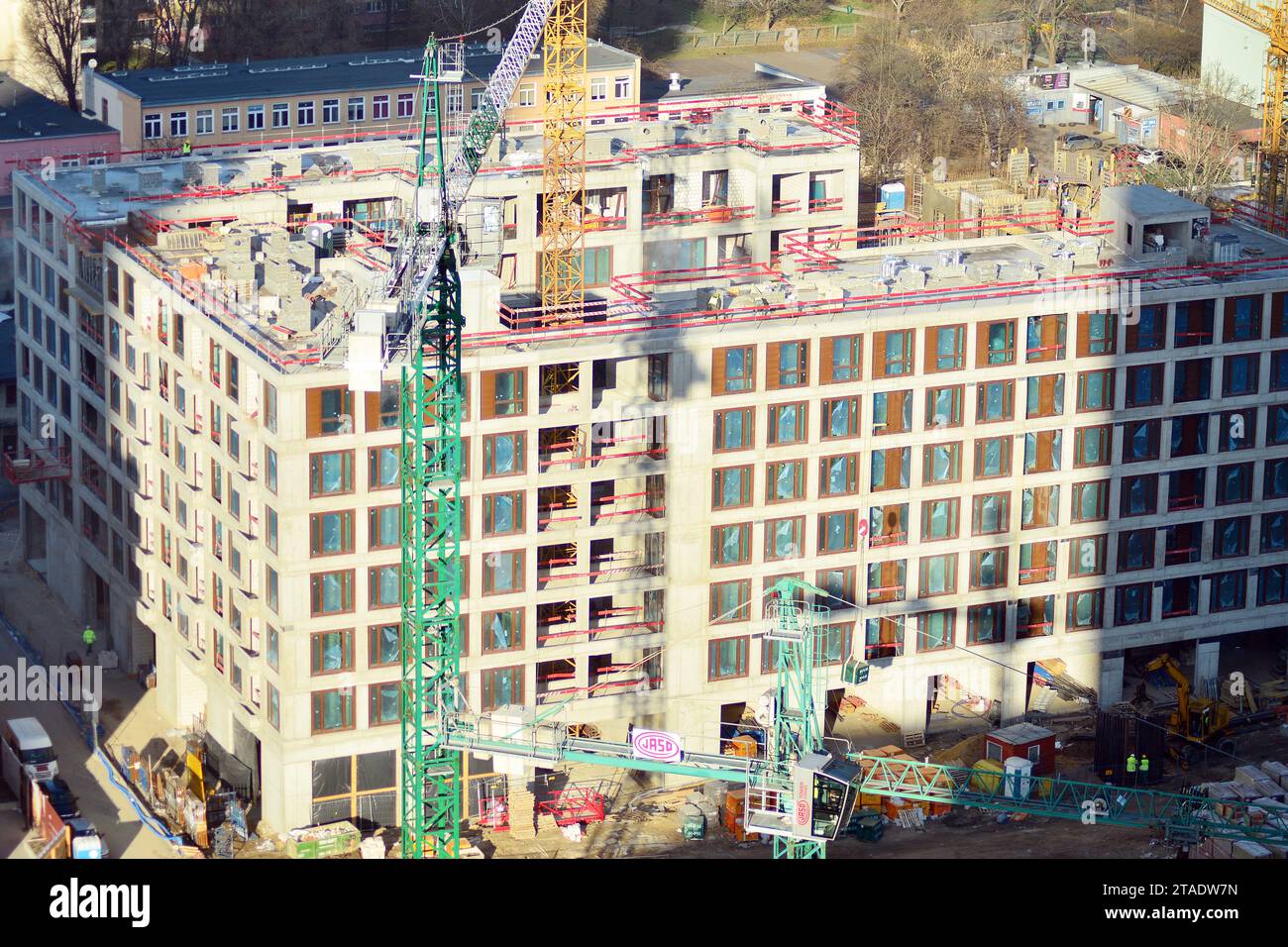 High rise building under construction. Installation of glass facade ...