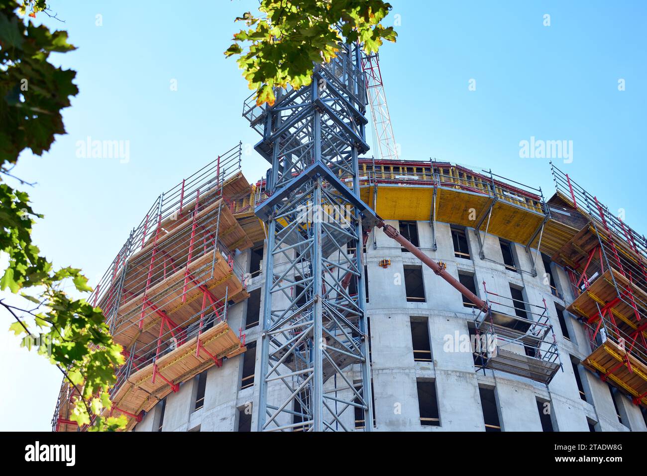 High rise building under construction. Installation of glass facade ...