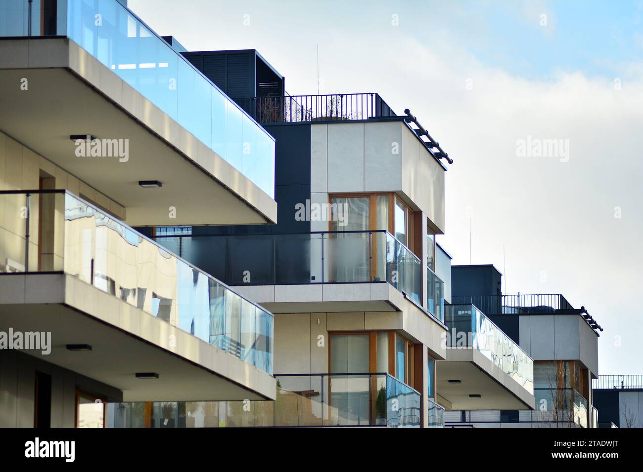 New apartment building with glass balconies. Modern architecture houses ...