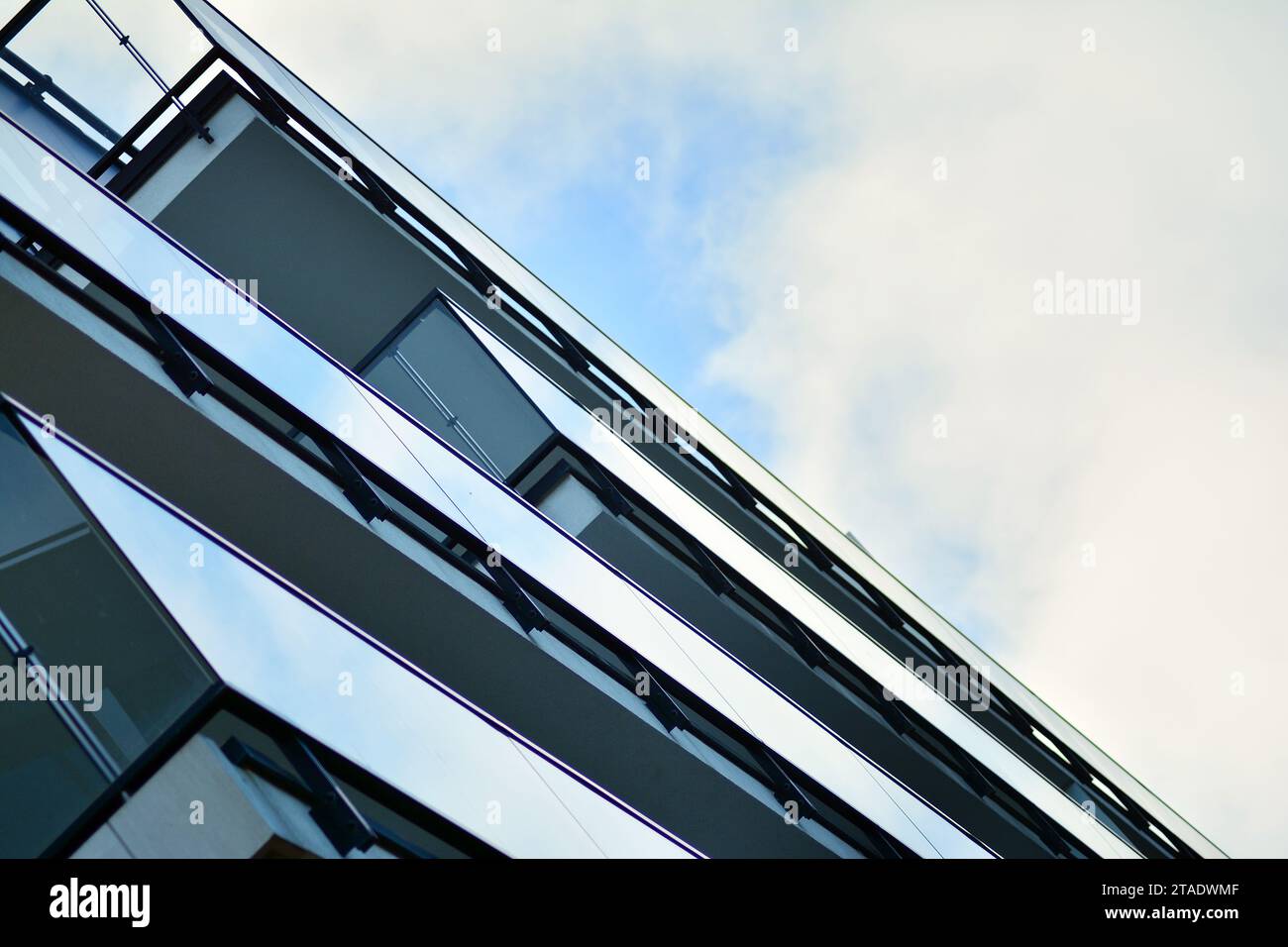 New apartment building with glass balconies. Modern architecture houses ...