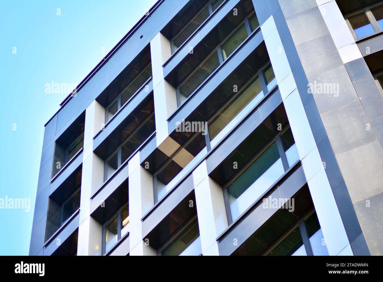 New apartment building with glass balconies. Modern architecture houses ...
