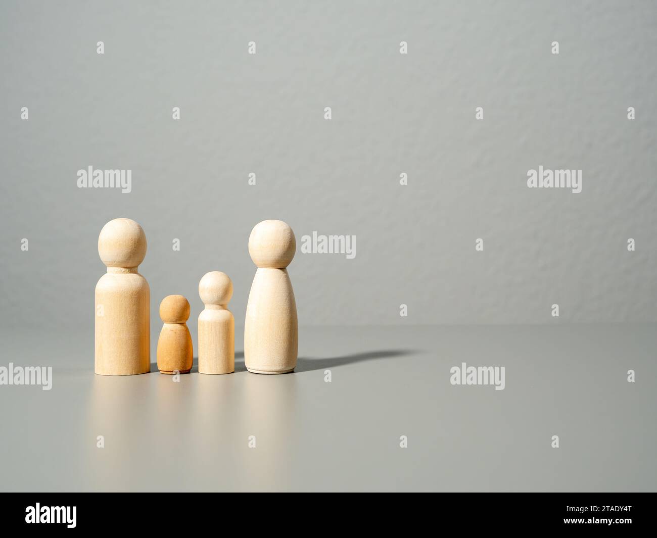 Wooden figures. Family on a gray background. Family values concept ...